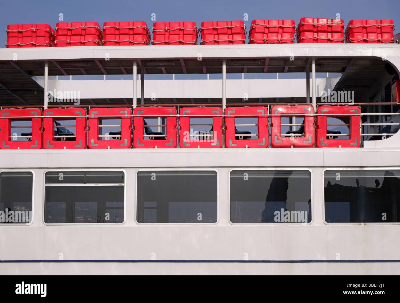 ferry boat windows and square lifebuoys on upper deck Stock Photo - Alamy