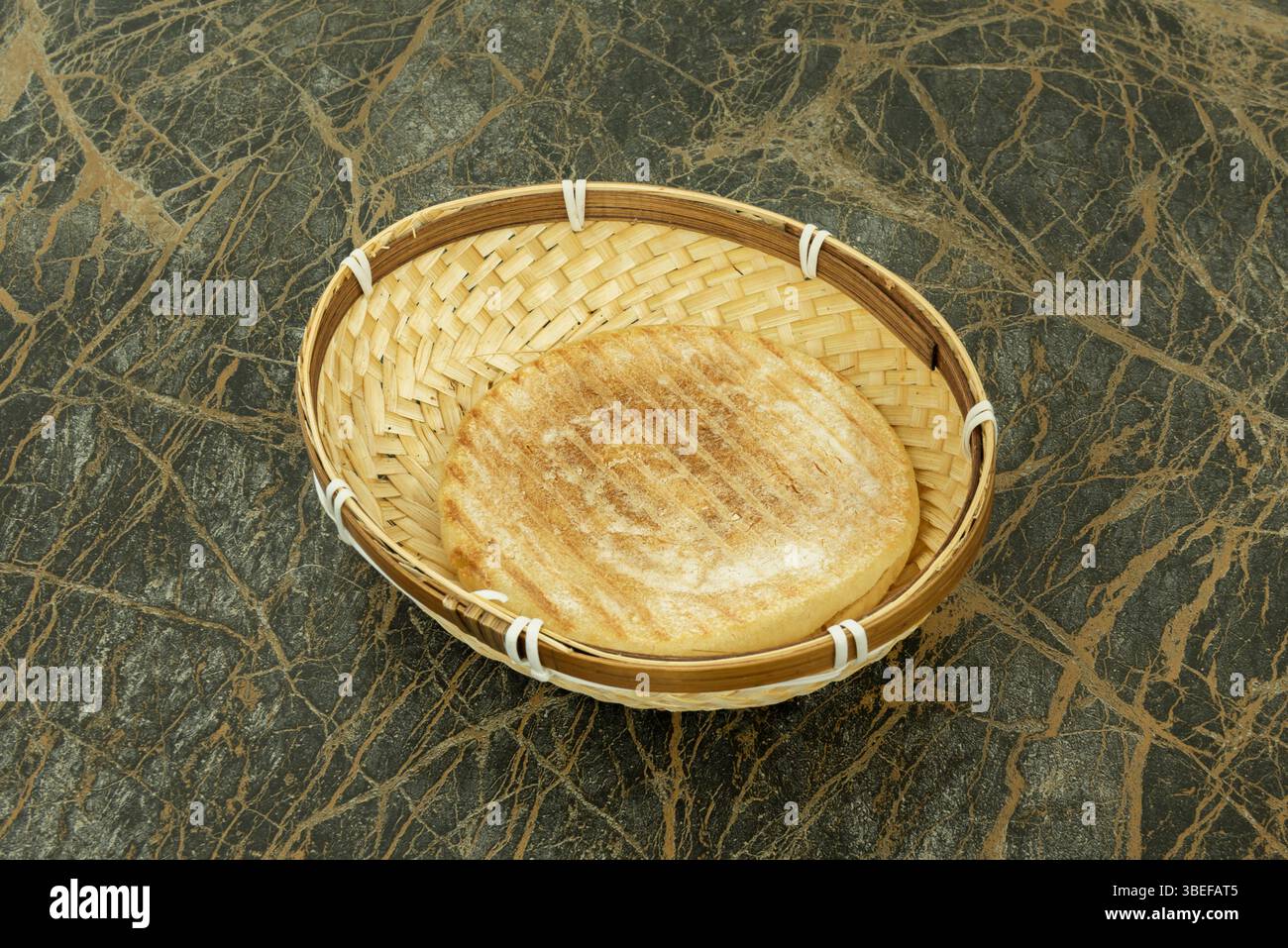 A kebab pita bread inside a wicker basket Stock Photo - Alamy