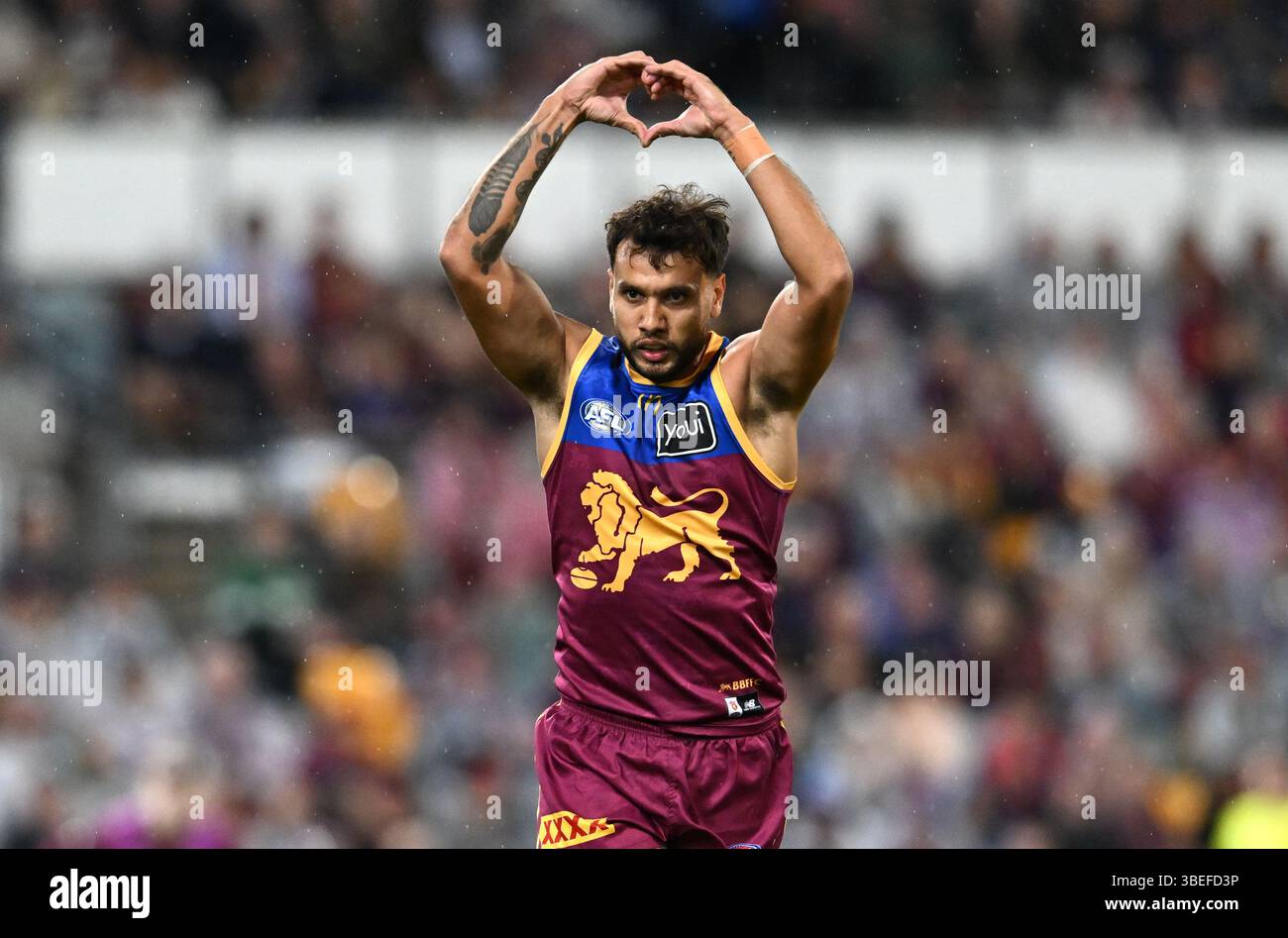 Callum Ah Chee of the Lions celebrates kicking a goal during the AFL ...