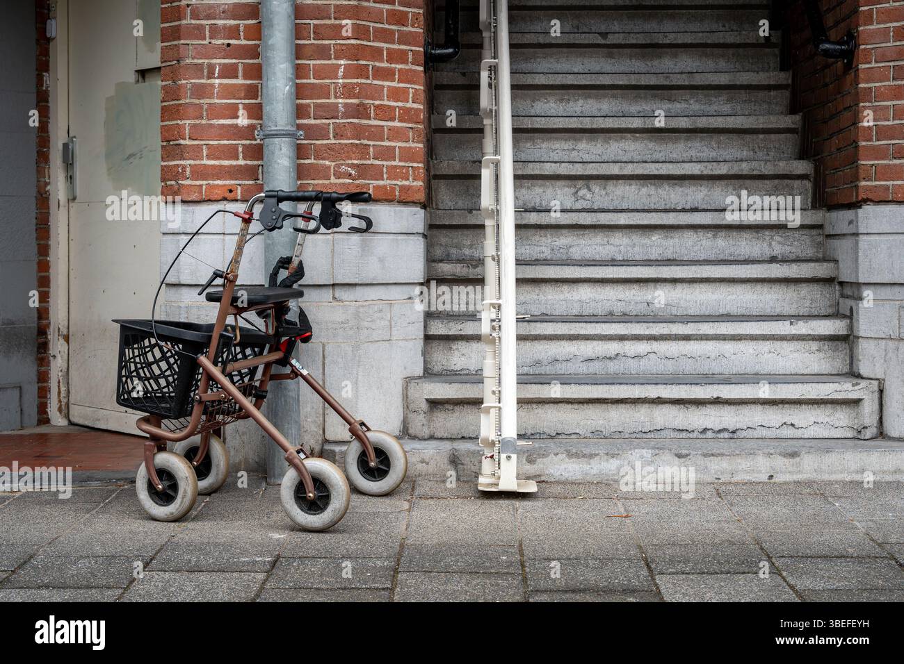 Mobility walker for elderly people in the street next to stair lift ...