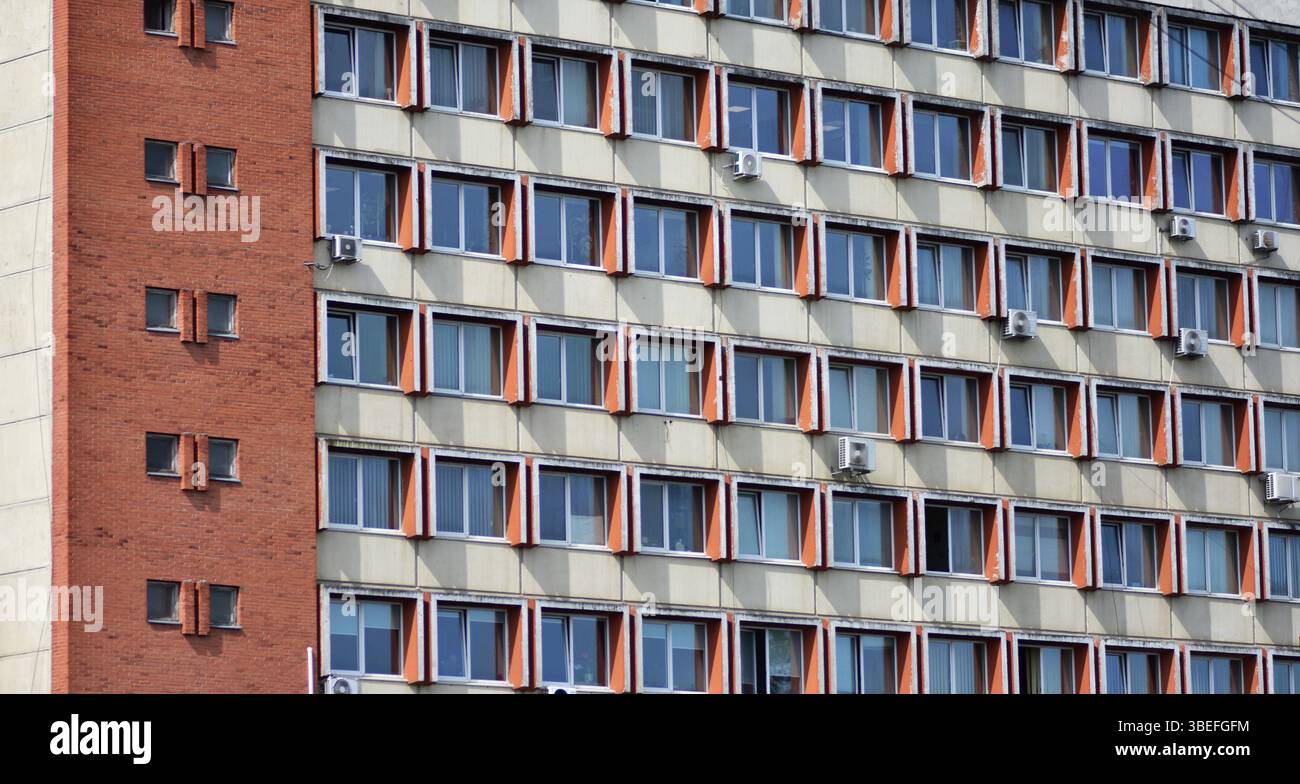 Facade of an old soviet residential, office building with repetitive ...