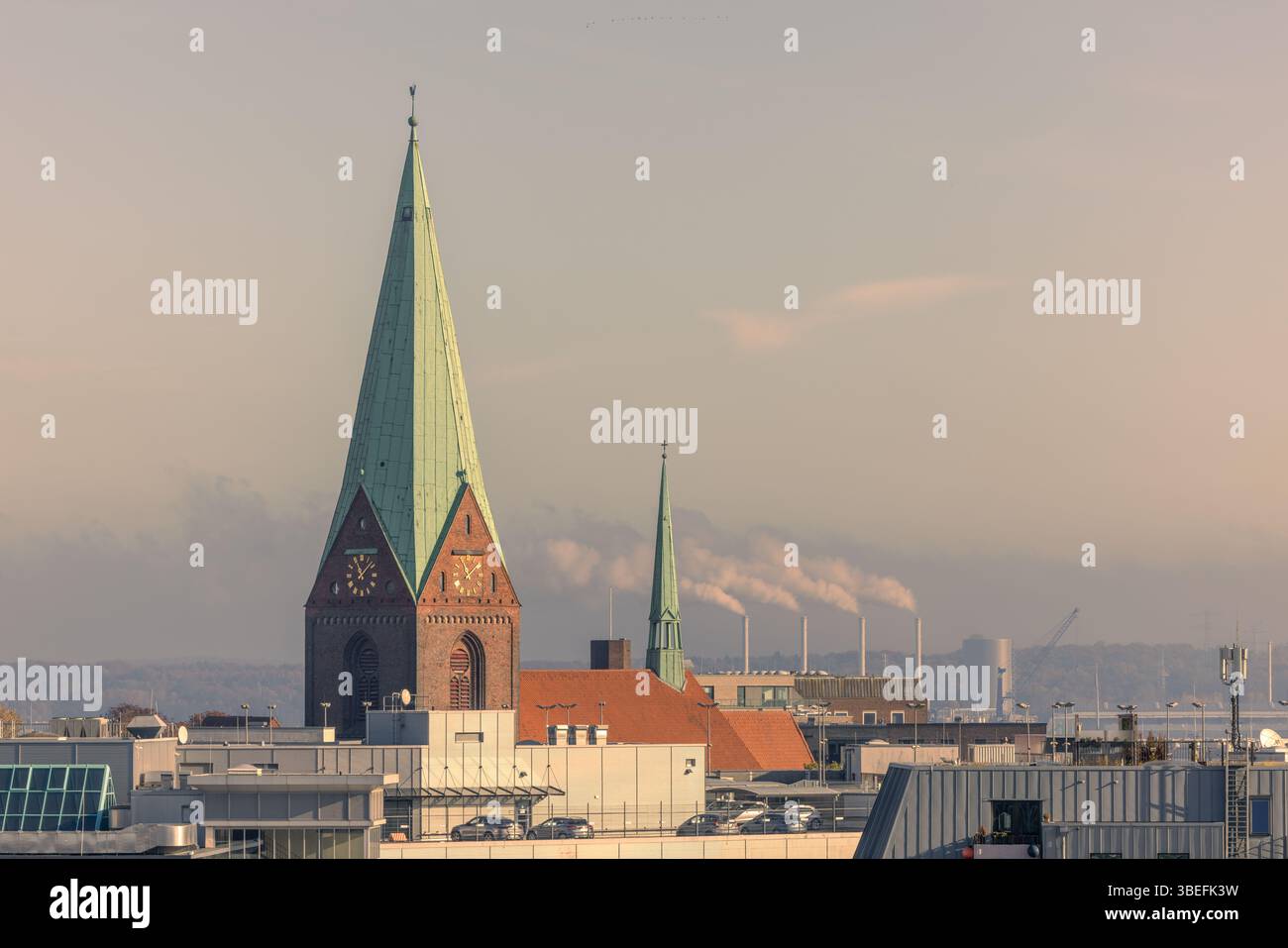 Rooftop view of Kiel, Germany, with the central church spire in warm ...