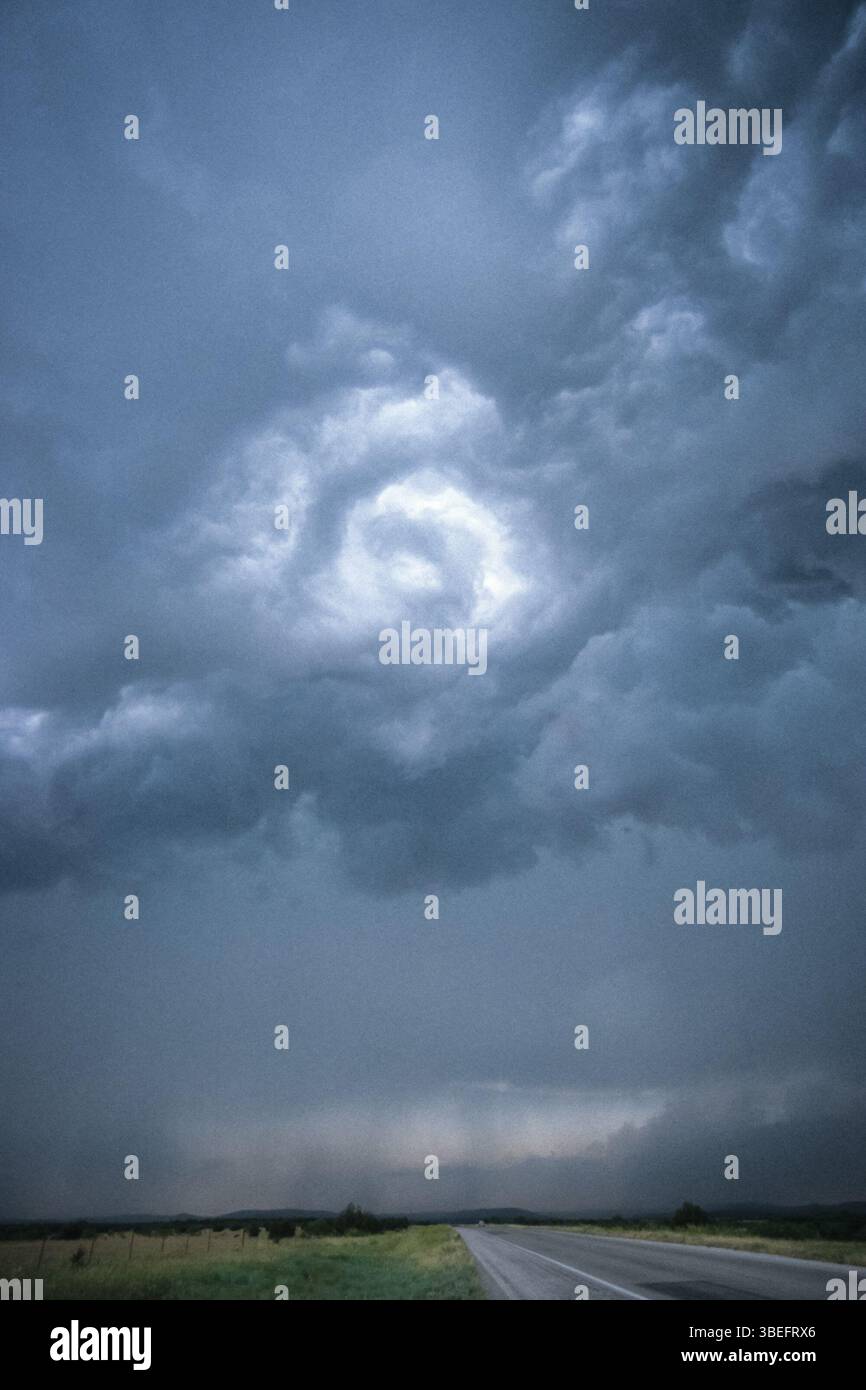 Rotating clouds of a strong thunderstorm over the road, west of Dallas ...