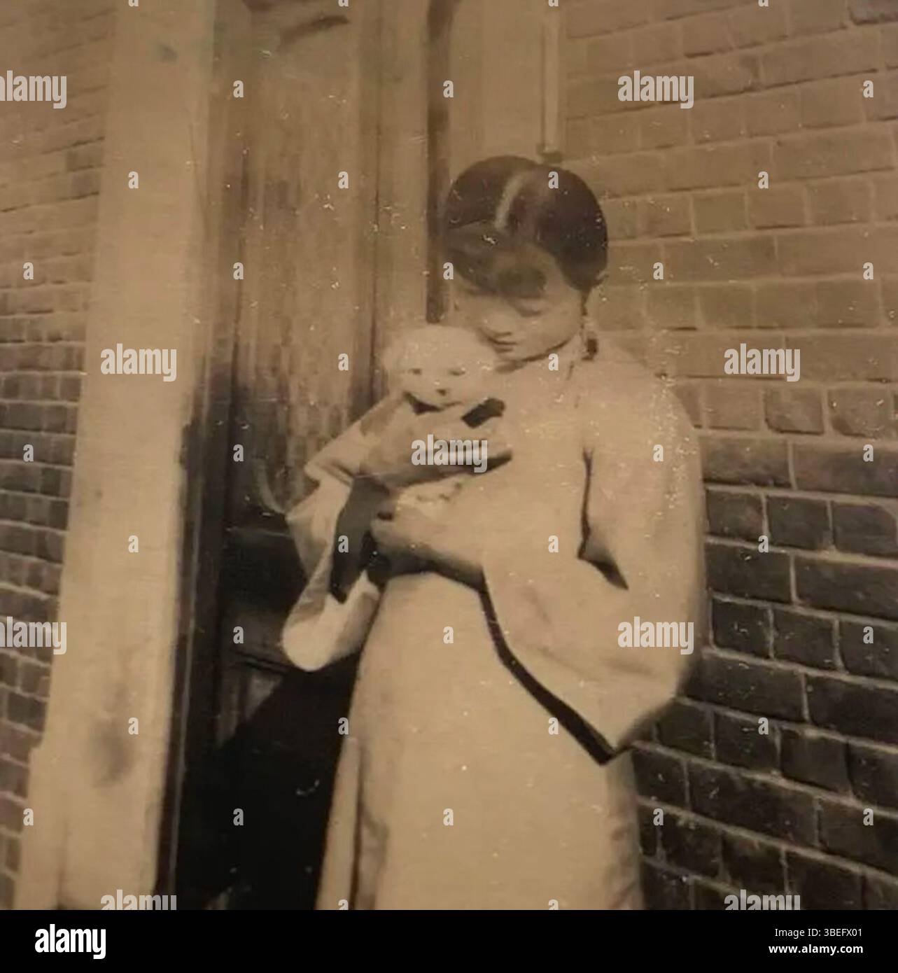 This photograph, taken between 1925 and 1929, shows Empress Wanrong of ...
