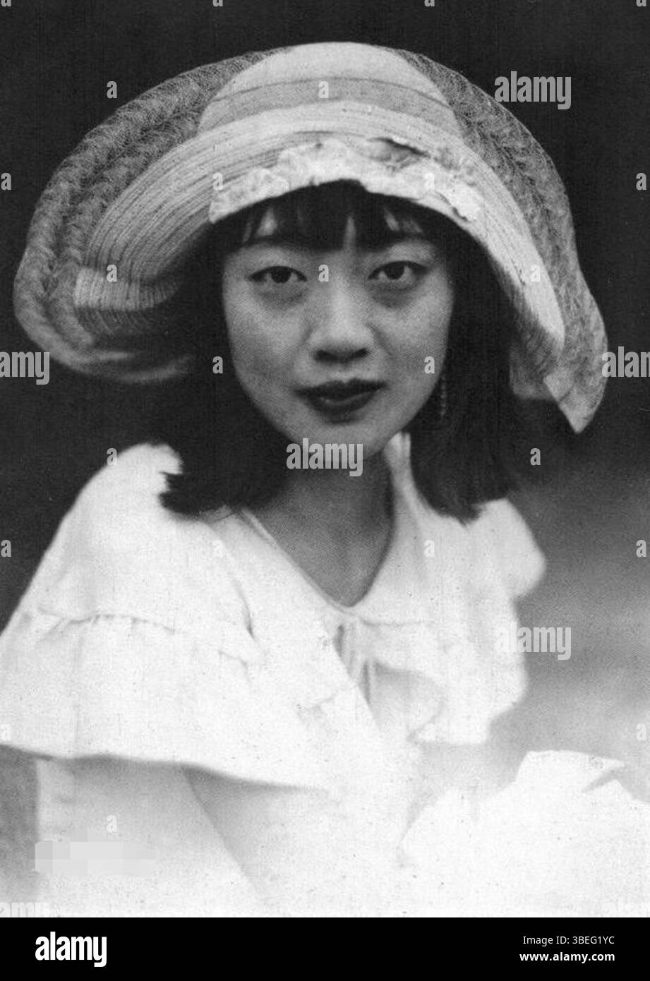 Wanrong, the last Empress of China, is shown between 1925 and 1931 wearing a formal hat ...