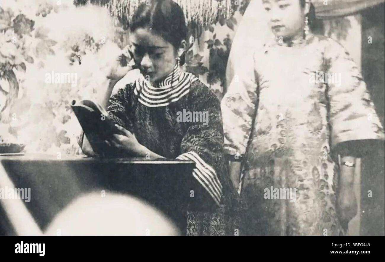 A photograph of Wanrong, Empress of China, taken between 1925 and 1931. This image provides a ...