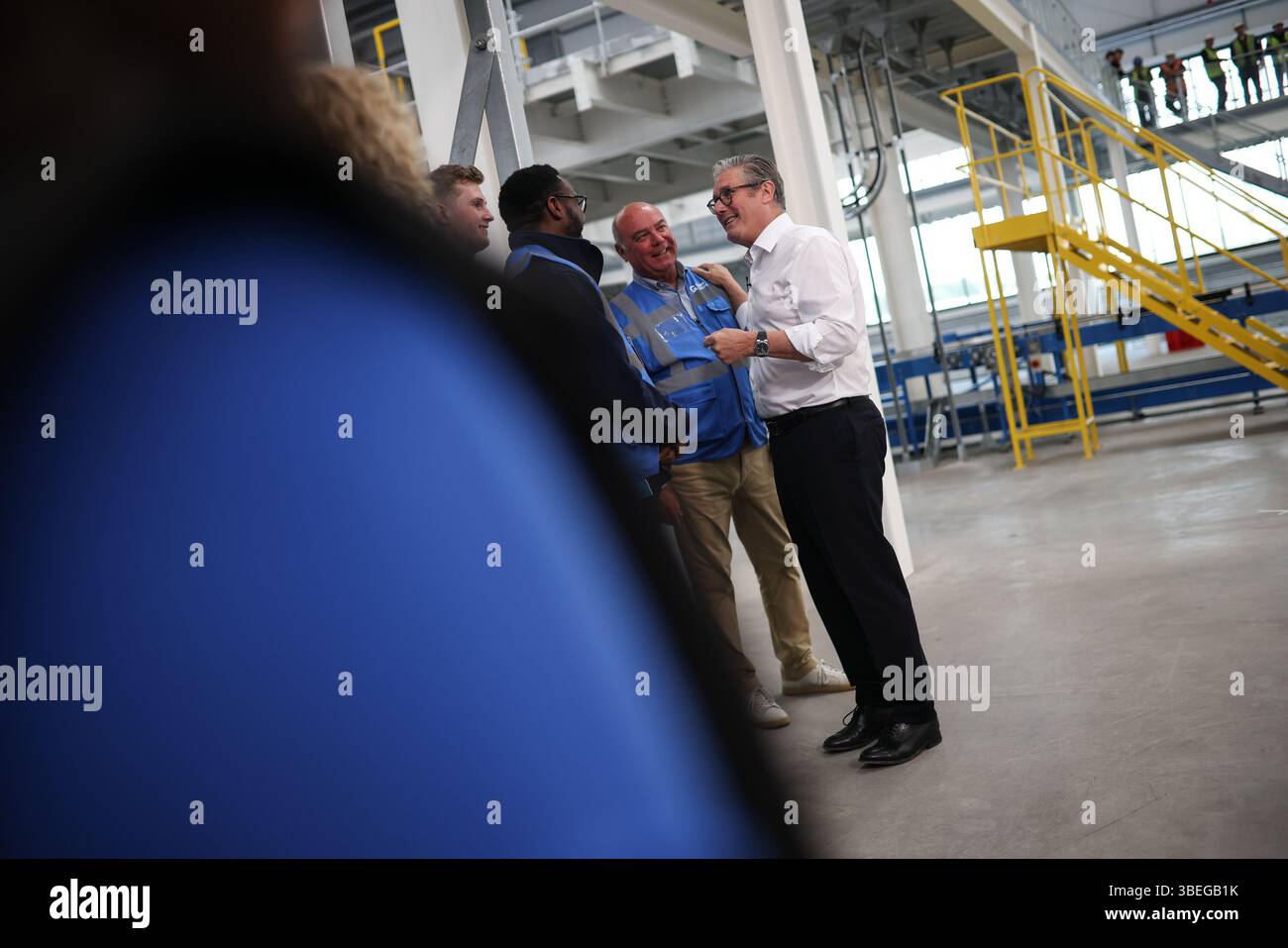 Prime Minister Sir Keir Starmer speaks to workers during a visit to ...