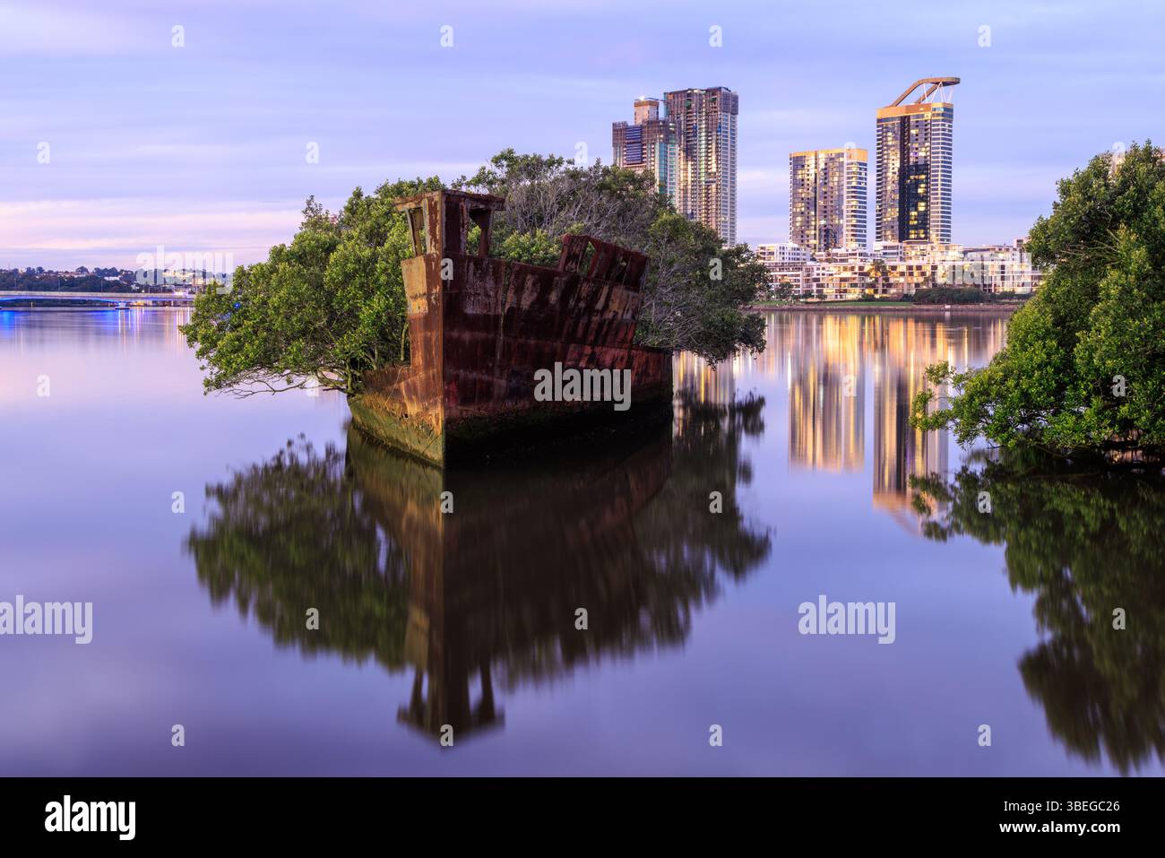 The wreck of the SS Ayrfield in Homebush Bay, Sydney, Australia. The rusty hulk is completely ...