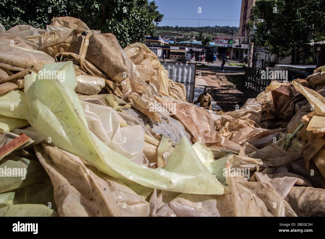 A man is seen working at a greenhouse plastic waste collection center ...