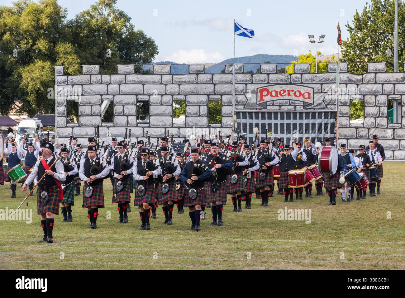 A traditional Highland pipe band in kilts, sporrans and Glengarry caps ...