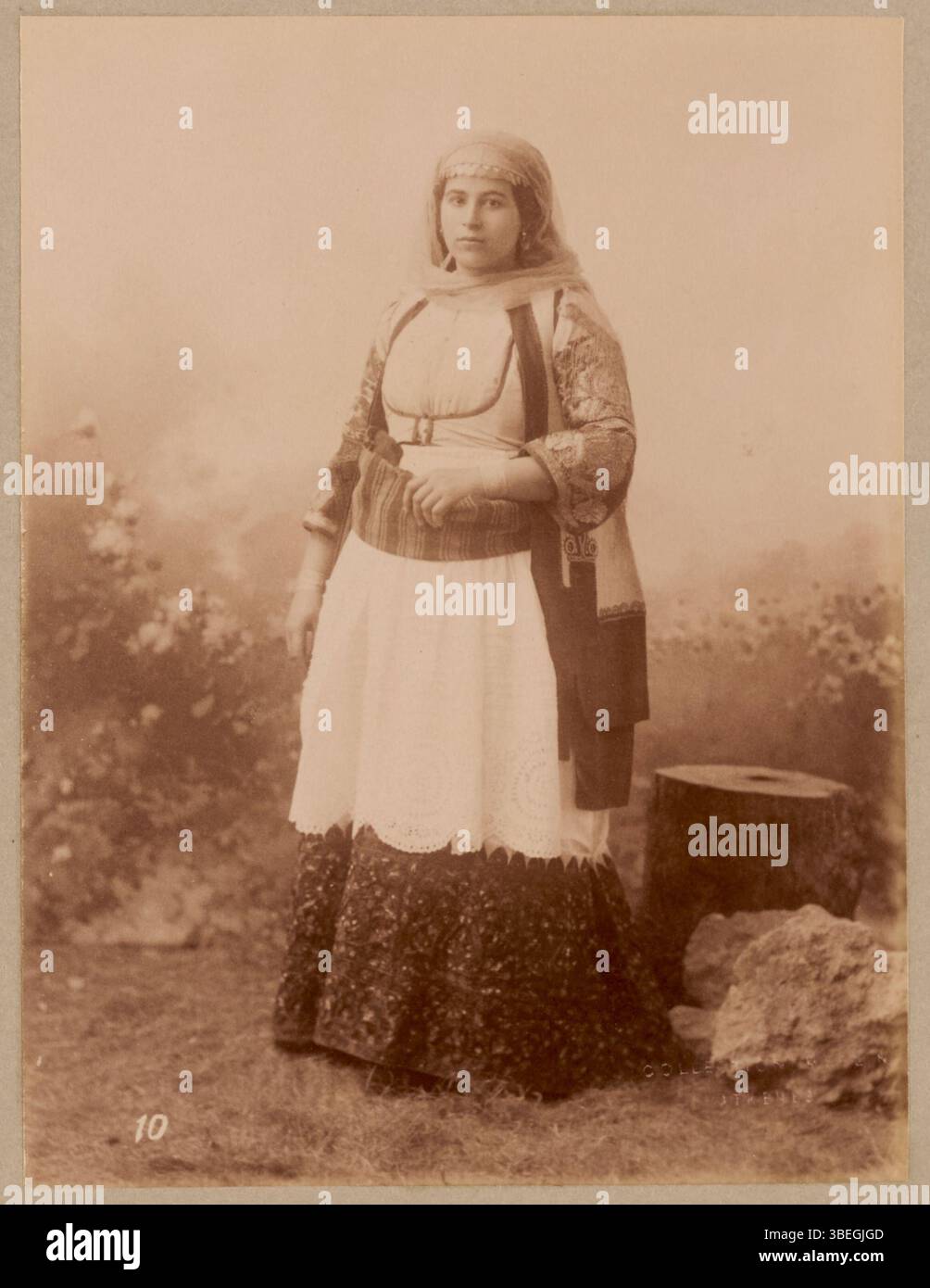 A studio portrait from the mid-1800s to early 1900s showing a woman ...