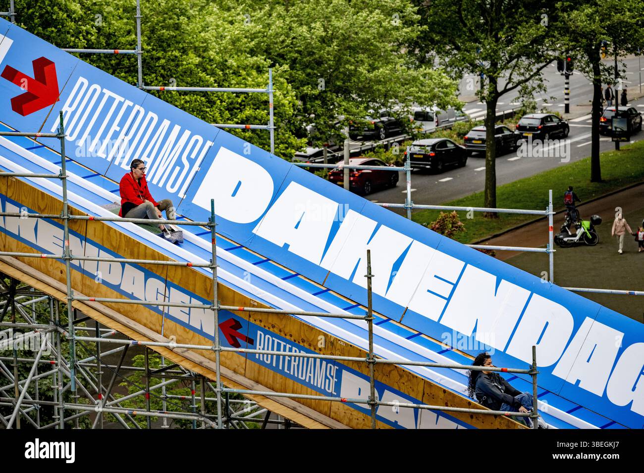 ROTTERDAM - Visitors use the Rotterdam Rooftop Roller Coaster during ...