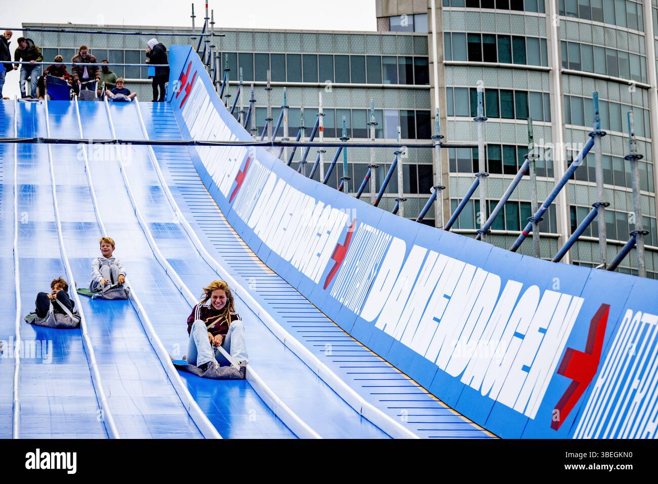 ROTTERDAM - Visitors use the Rotterdam Rooftop Roller Coaster during ...
