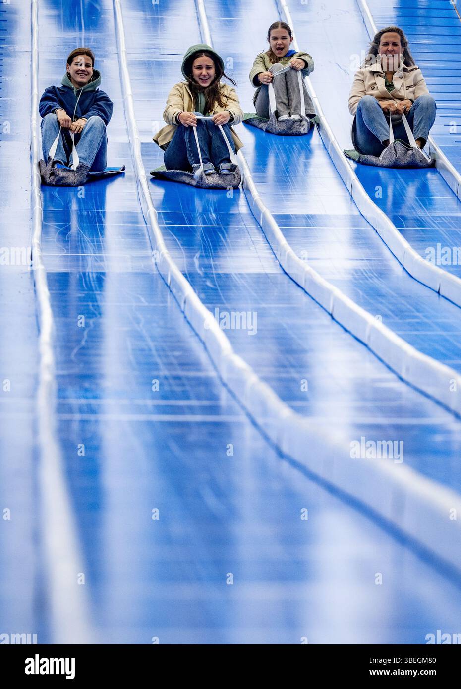 ROTTERDAM - Visitors use the Rotterdam Rooftop Roller Coaster during ...