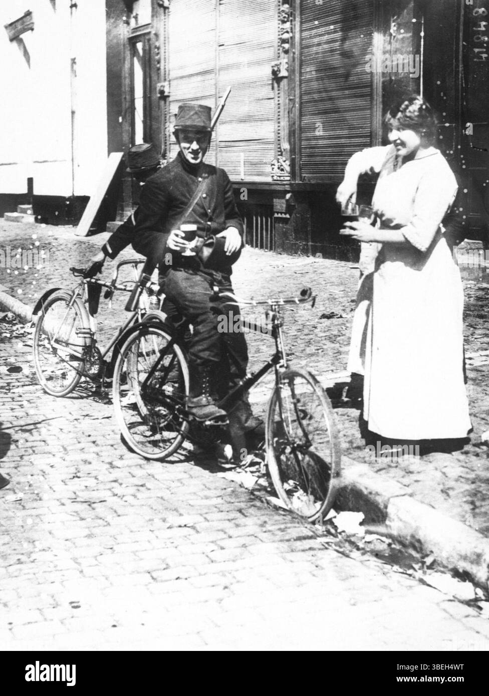 This photograph from August 1914 shows a woman in Tienen, Belgium ...