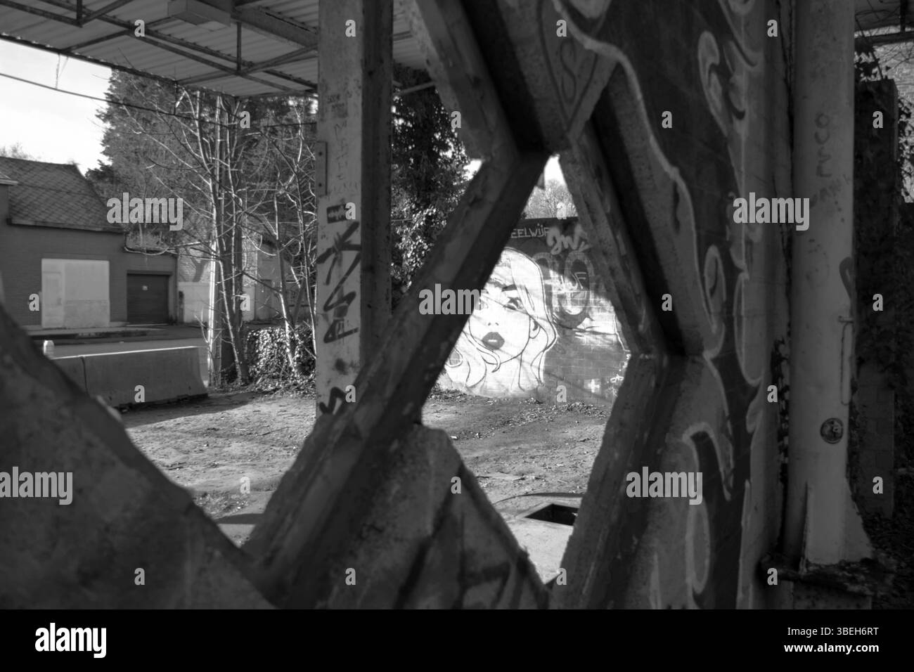 View through an abandoned structure showcasing urban graffiti art and ...