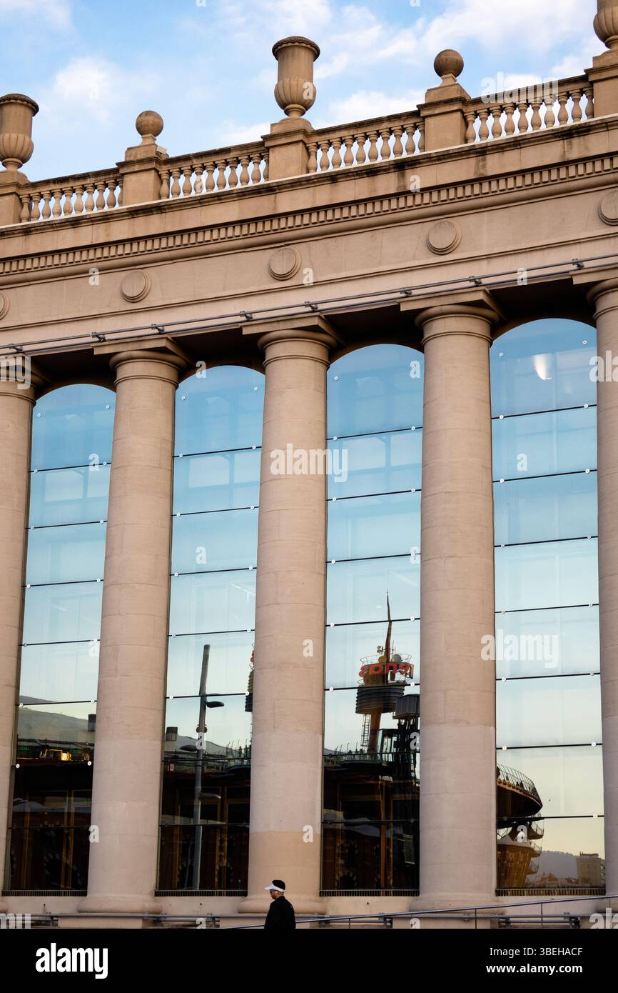 Architectural design features prominent pillars and reflective glass ...