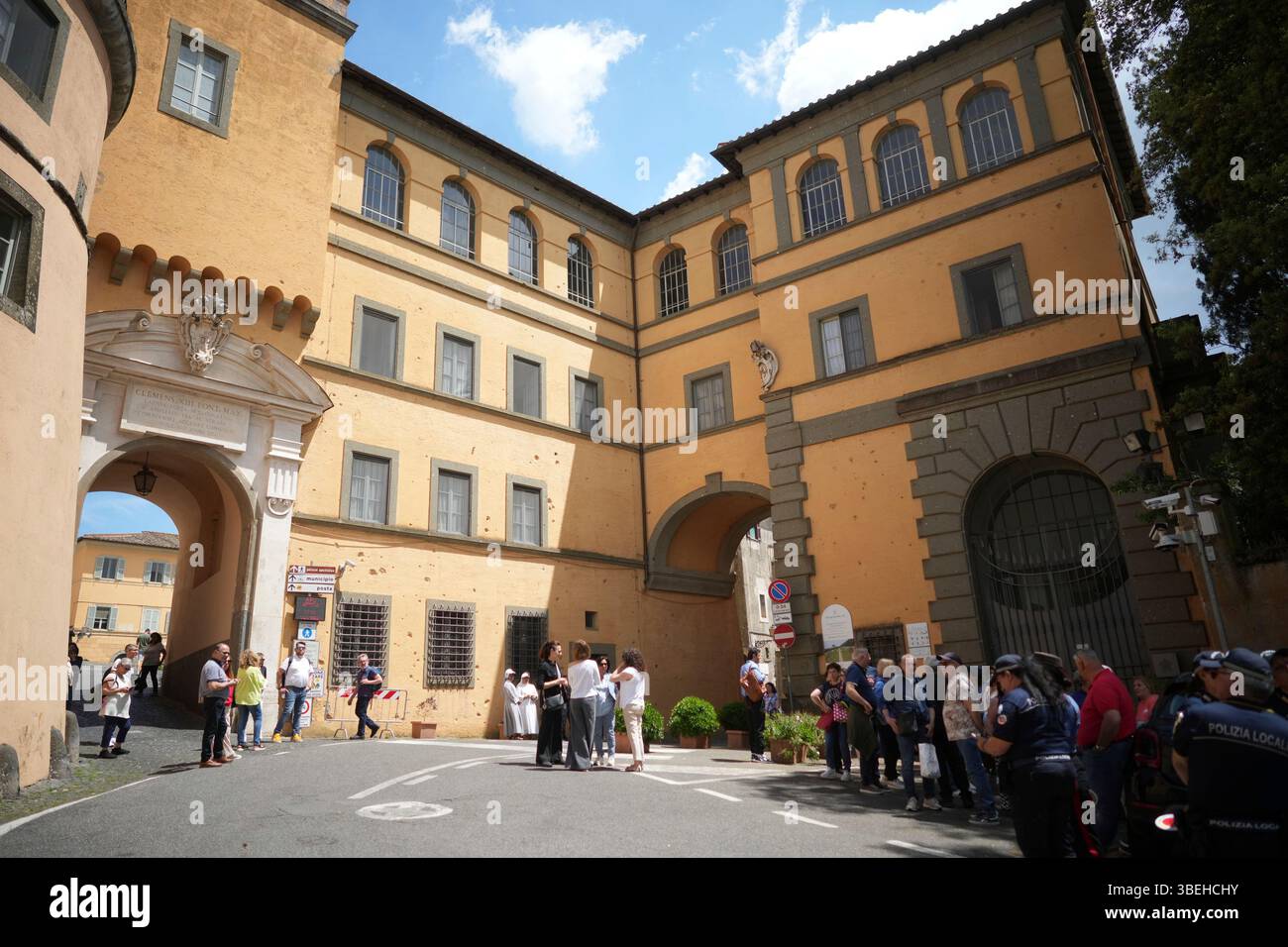 People walk in the streets of Castel Gandolfo, about 30 kilometers ...