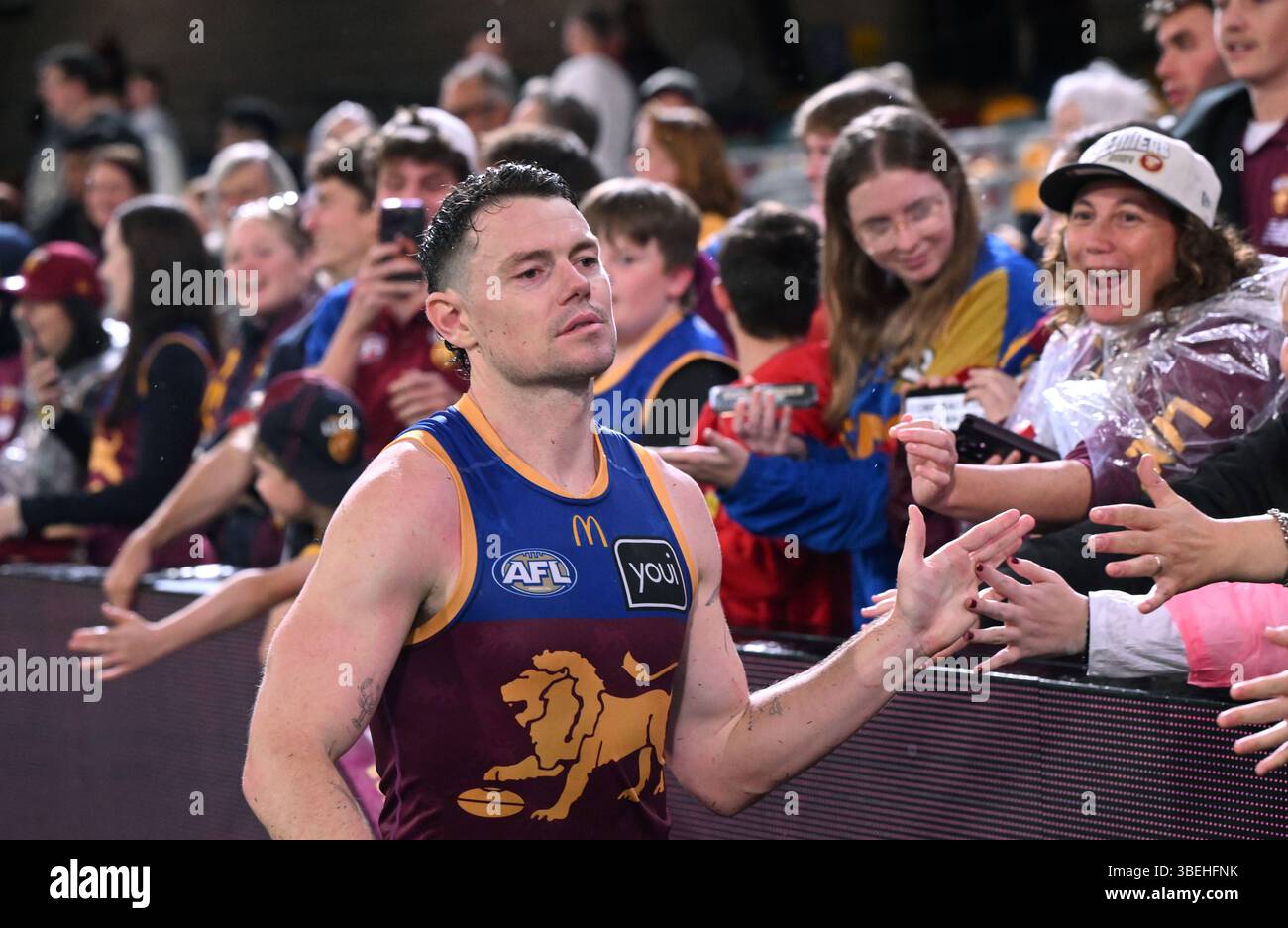 Lachie Neale of the Lions celebrates winning with fans during the AFL ...
