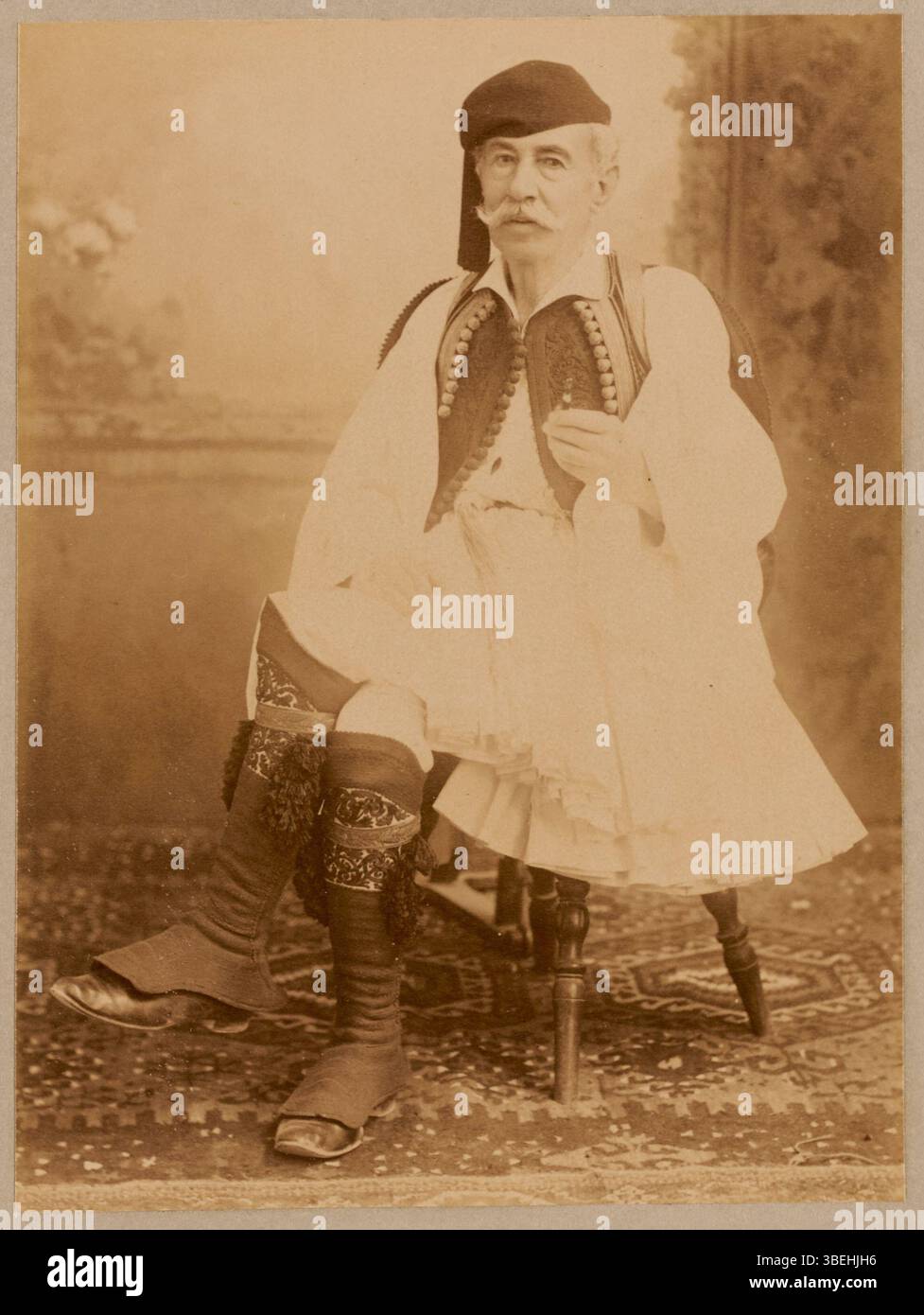 This studio portrait shows a man in traditional Greek dress from the ...