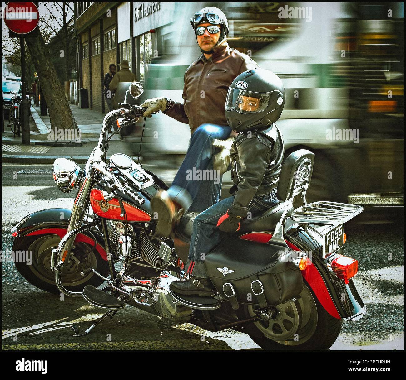 Harley Davidson, father and son on Bike Stock Photo - Alamy