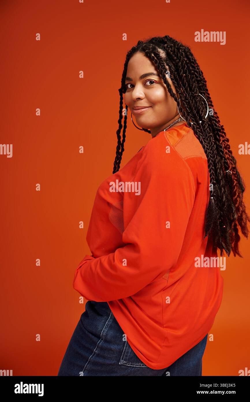 A woman with beautiful braids poses confidently in a stylish outfit ...