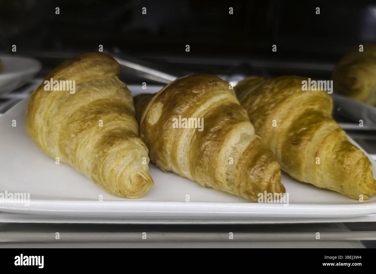 Artisanal chocolate croissant in a grocery, sweets and desserts store ...