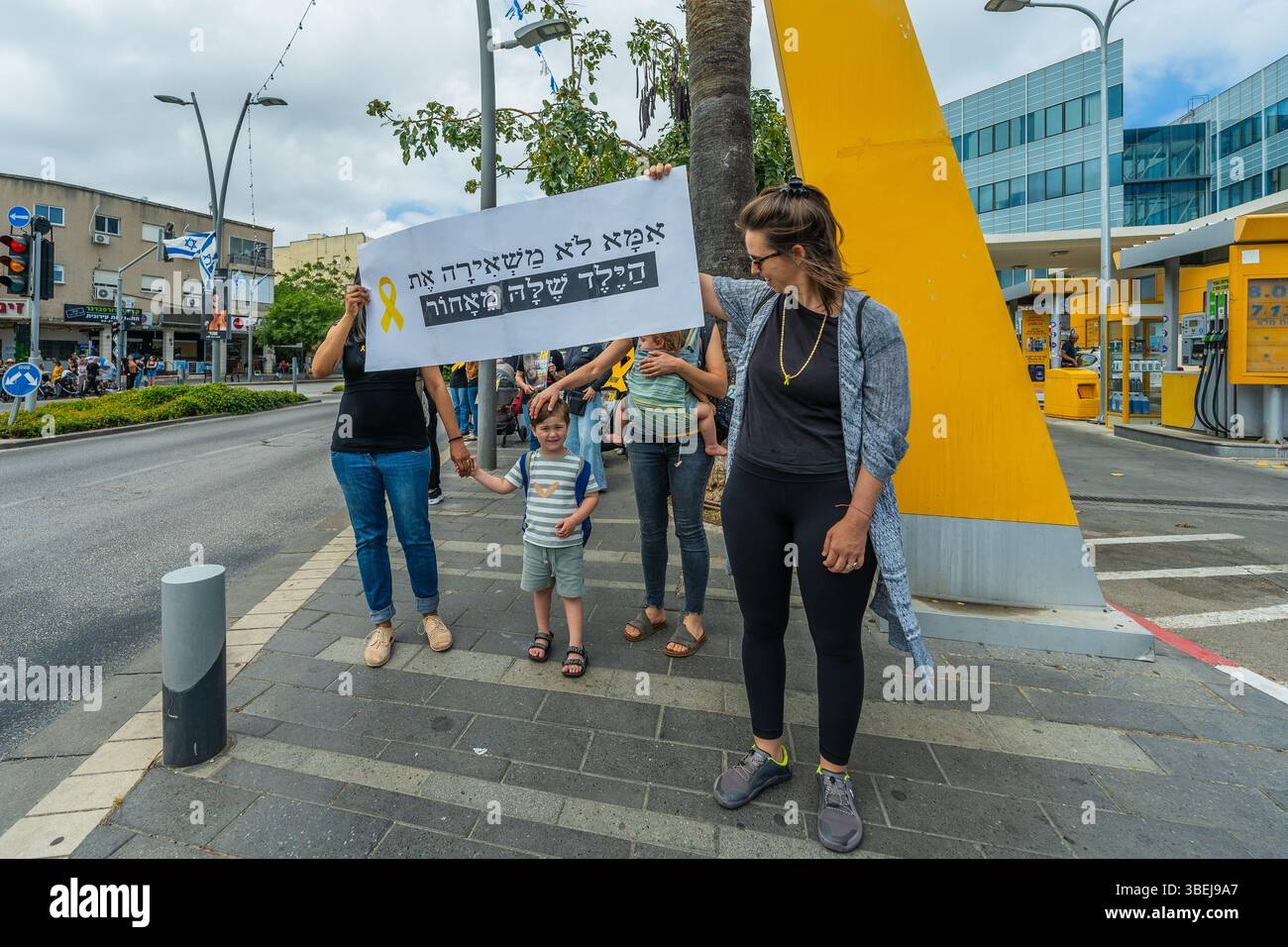 Haifa, Israel - May 28, 2025: People march in a symbolic baby carriage ...