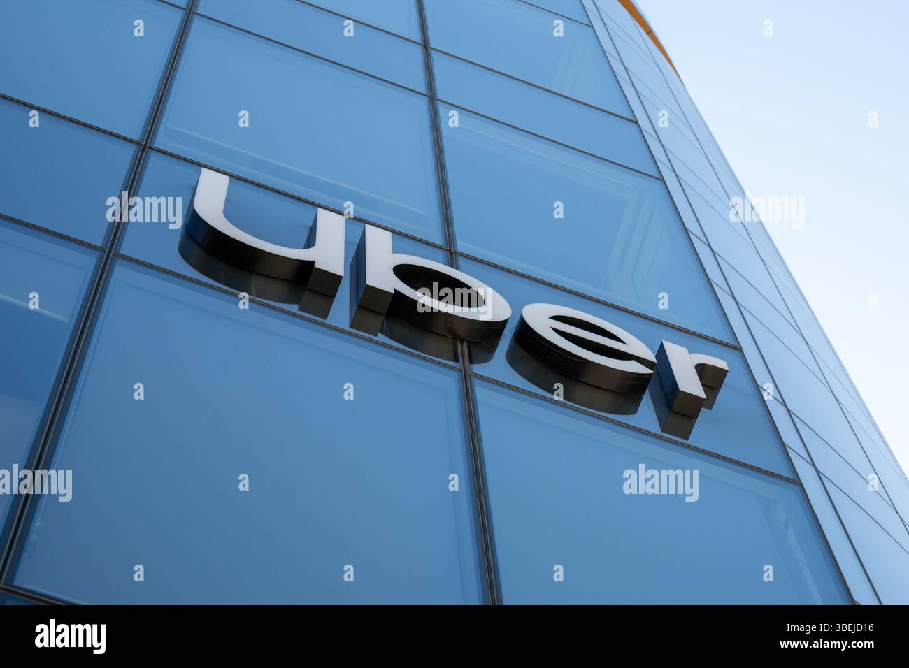 Facade of Uber headquarters with logo prominently displayed on glass ...