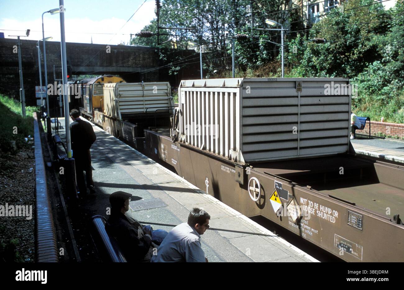 A train transporting two flasks of irradiated nuclear fuel (under metal covers) passing through ...
