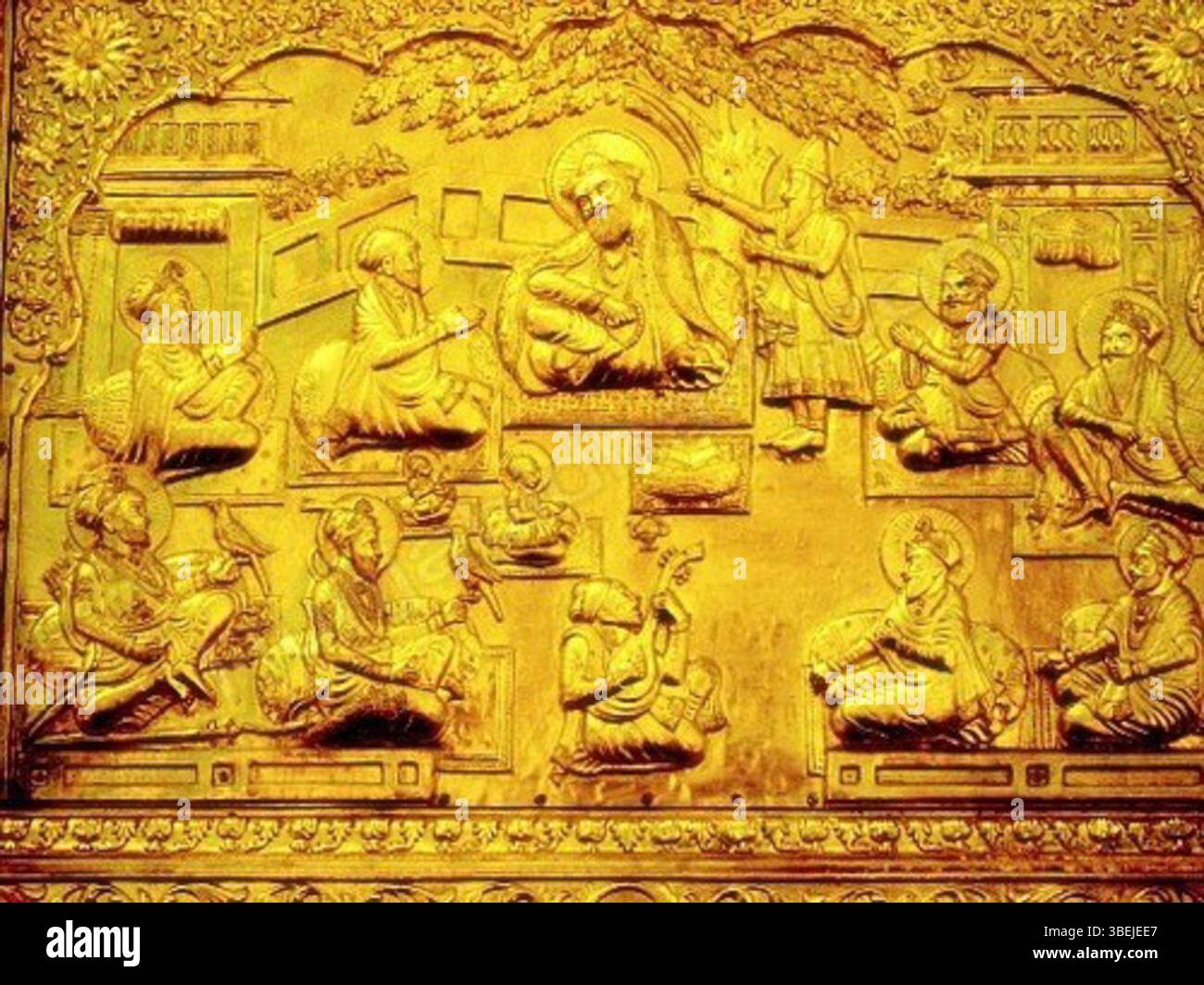 This gilded repoussé plaque showcases the ten Sikh Gurus, engraved in ...