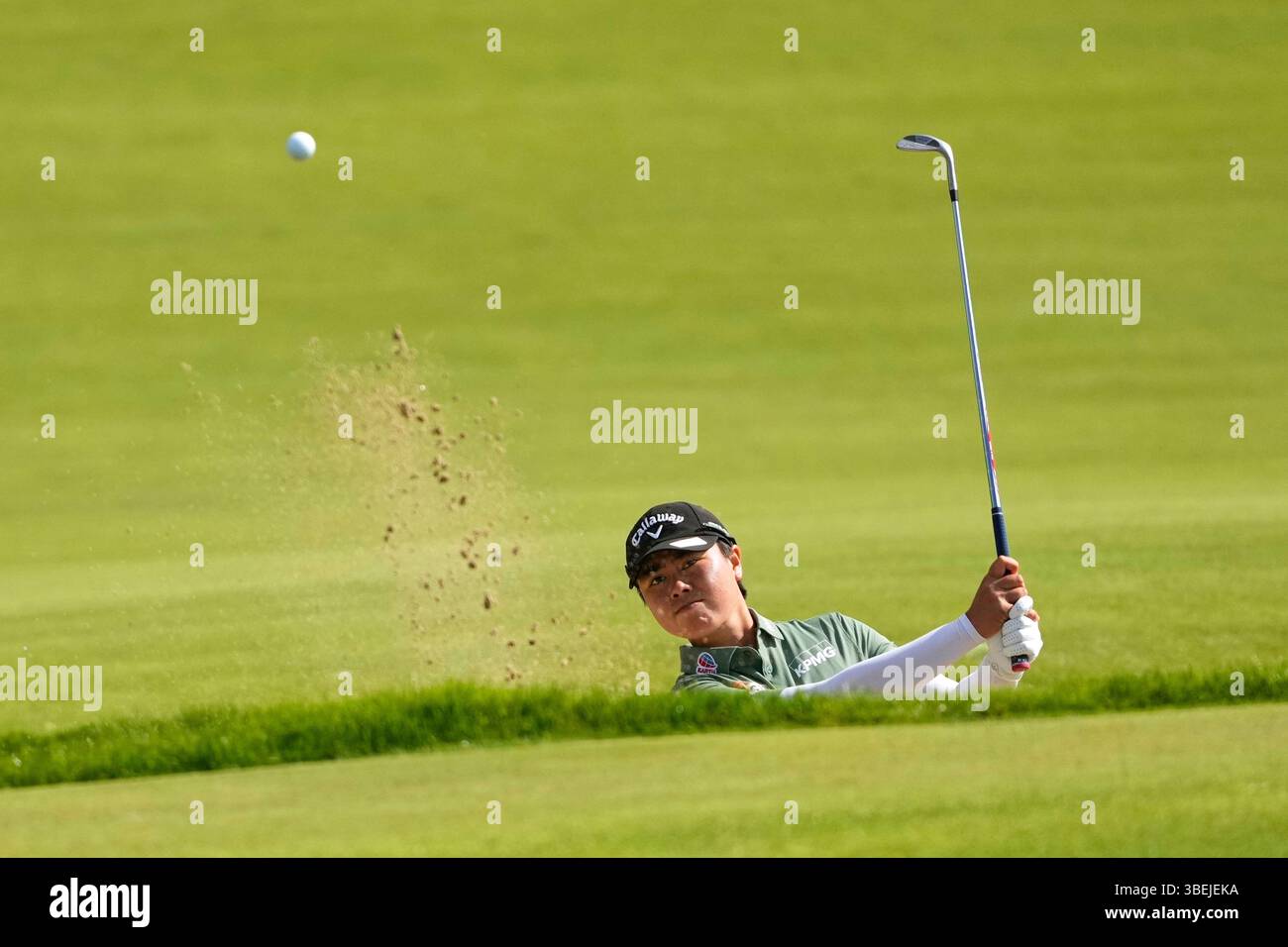 Yuka Saso, of Japan, hits from the bunker on the 14th hole during the ...