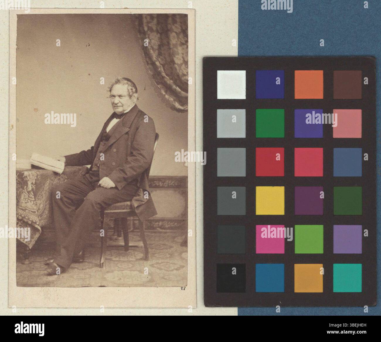 This black-and-white photograph, mounted on cardboard, depicts ...