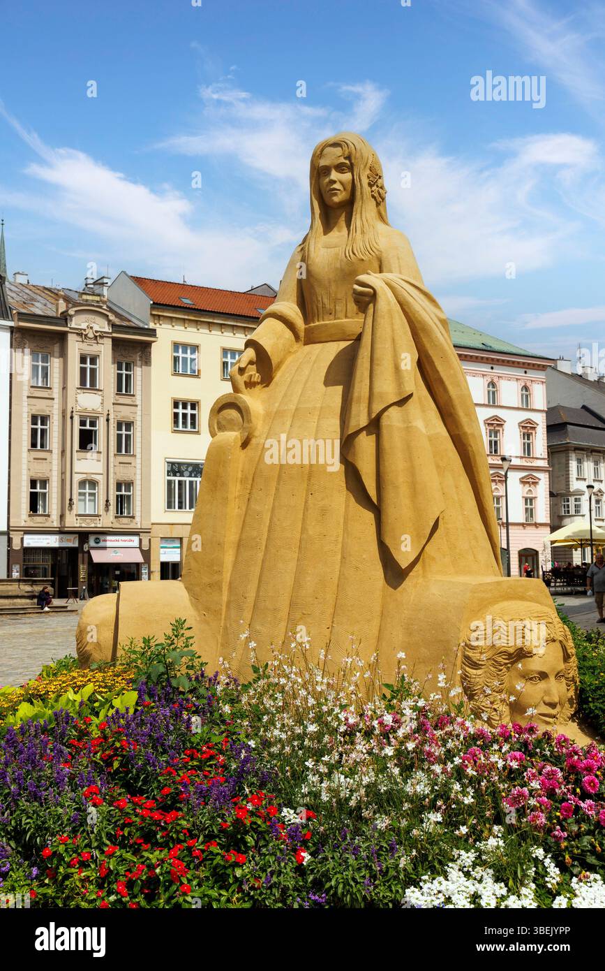 Statue of woman pouring water from a pitcher, Olomouc, Moravia, Czech ...