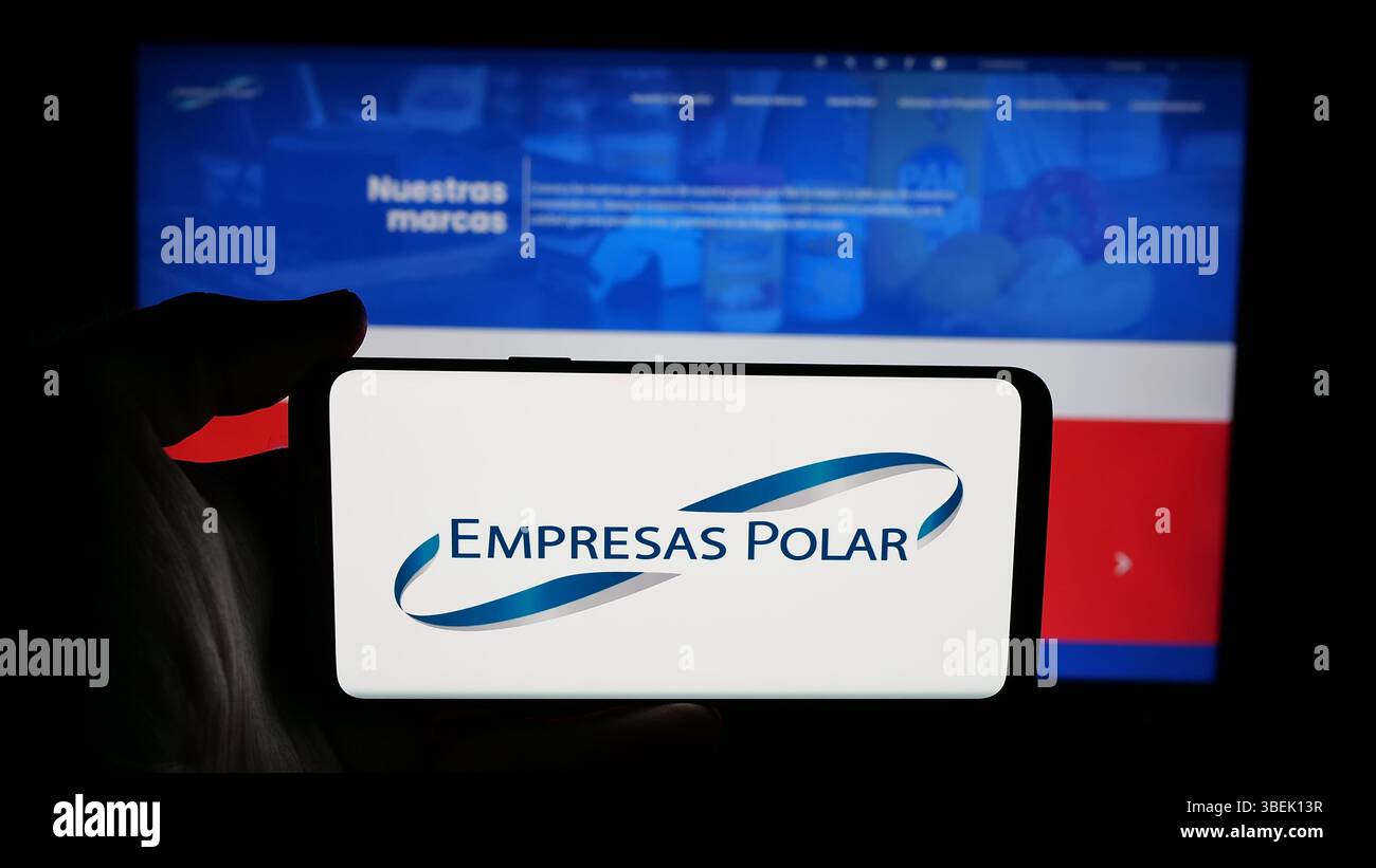 In this photo illustration, a person is holding a cellphone with the ...