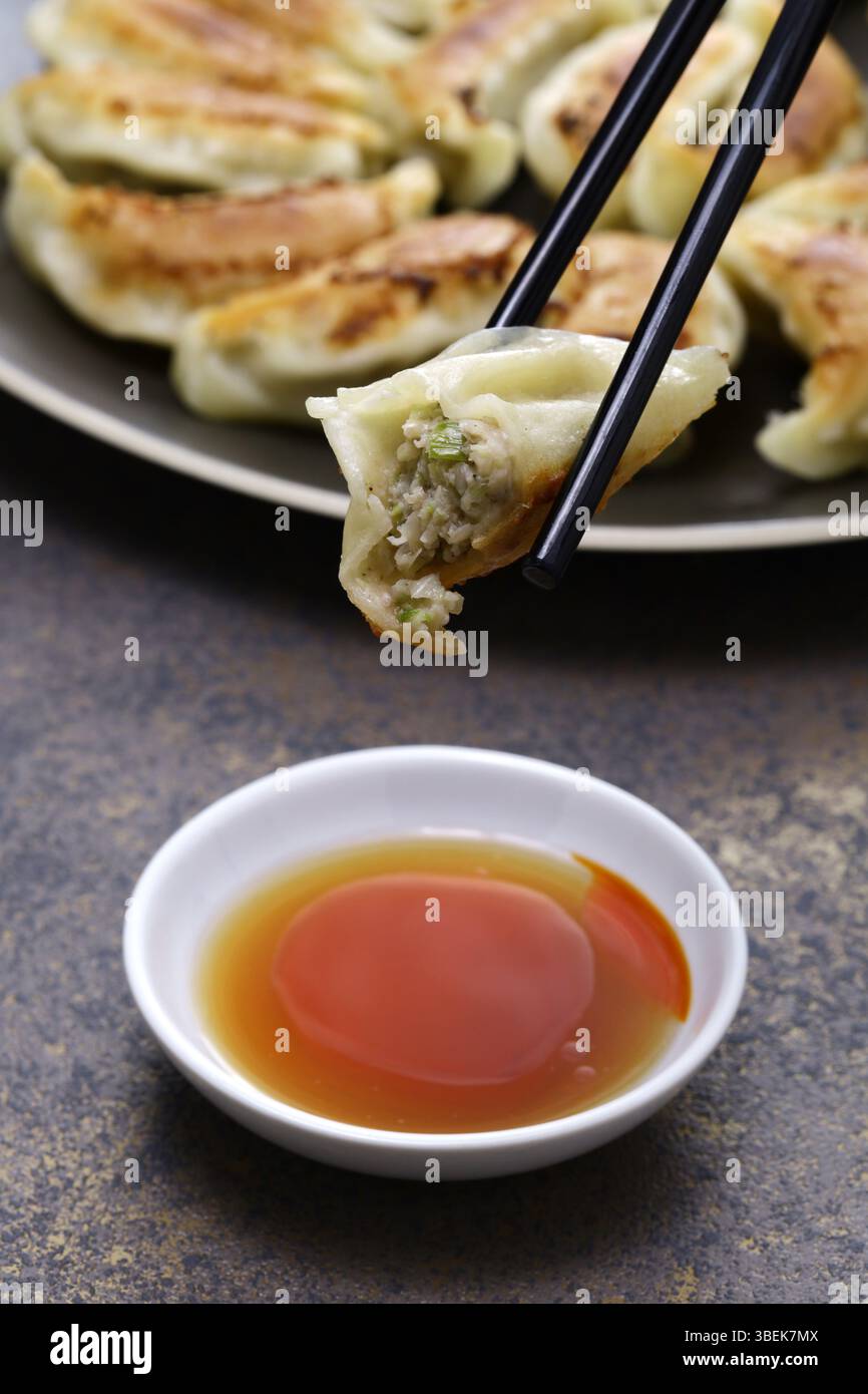 Gyoza, Japanese potstickers are mainly steamed in frying pan, then ...