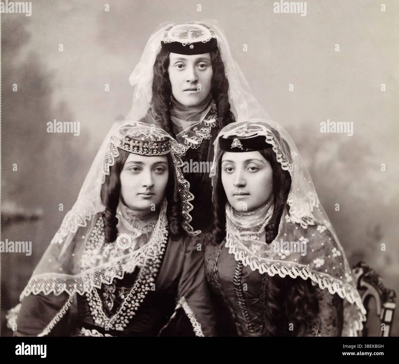 Three Georgian women in fine traditional clothing pose for a portrait ...