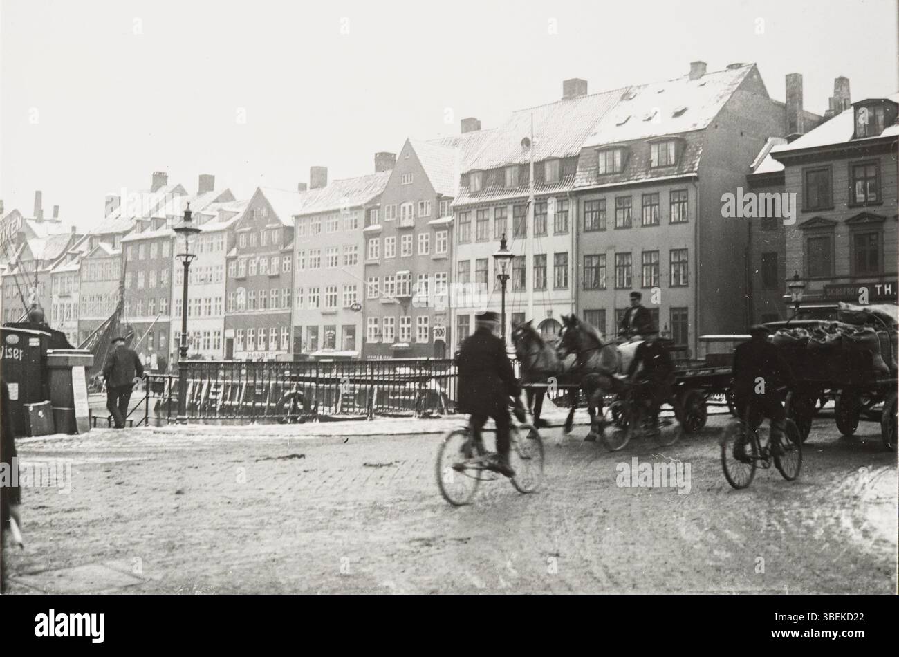 This painting by Paul Gustav Fischer captures a view of Nyhavn in Copenhagen, Denmark, showing ...