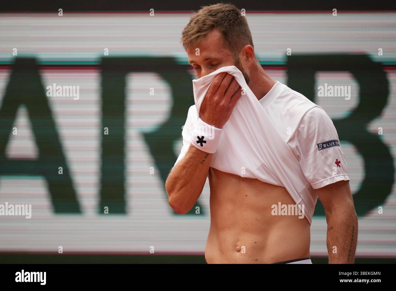 France's Corentin Moutet reacts as he plays Serbia's Novak Djokovic ...