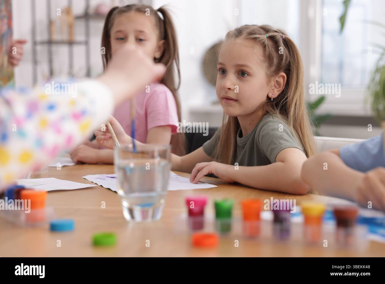 Kids painting table indoors learning hi-res stock photography and ...