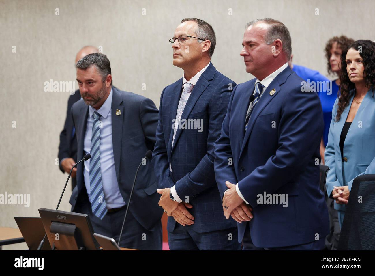 Former Michigan State Police trooper Brian Keely, center, appears in ...