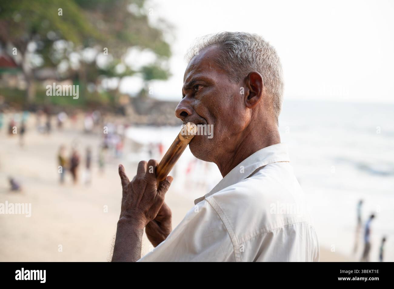 Indian Man Playing Flute On The Beach Of Kochi, India, Musician ...