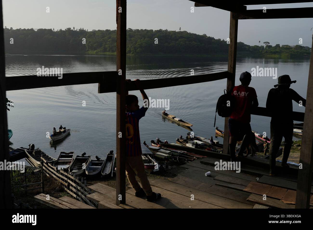 People stand on a platform overlooking the Bayano River where fishermen ...