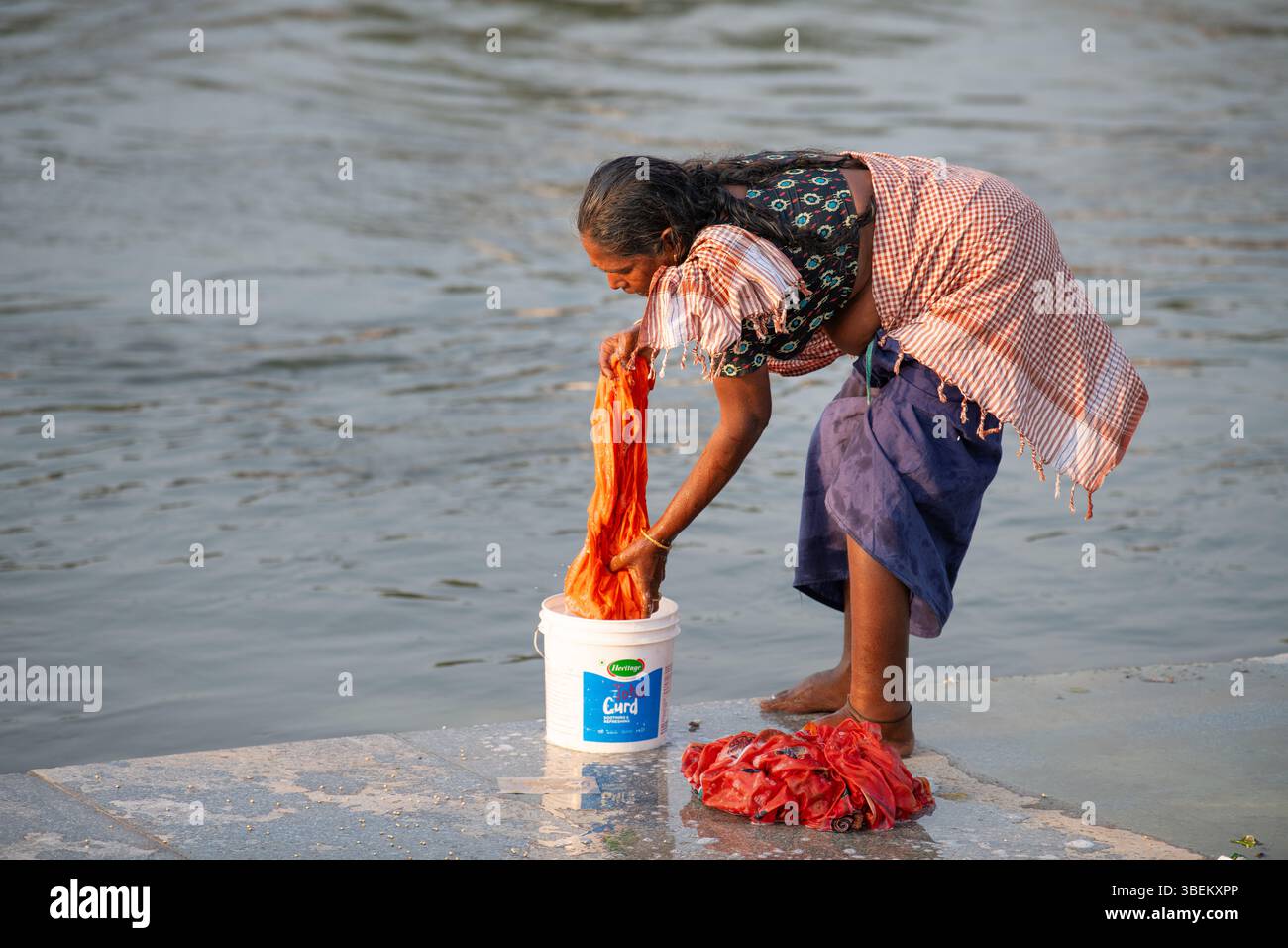 Indian Woman Washing Clothes At Tungabhadra River, Hampi, Colorful Fabrics, Traditional Bangles ...
