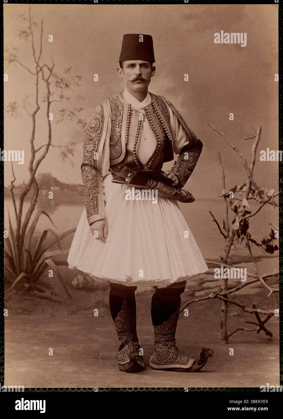 A studio portrait of a man in traditional Greek attire from the Kerkira ...
