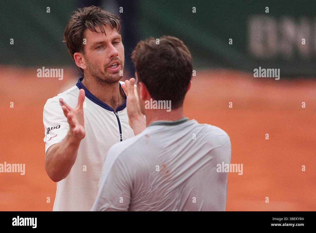Britain's Cameron Norrie, left, greets Argentina's Federico Gomez after ...
