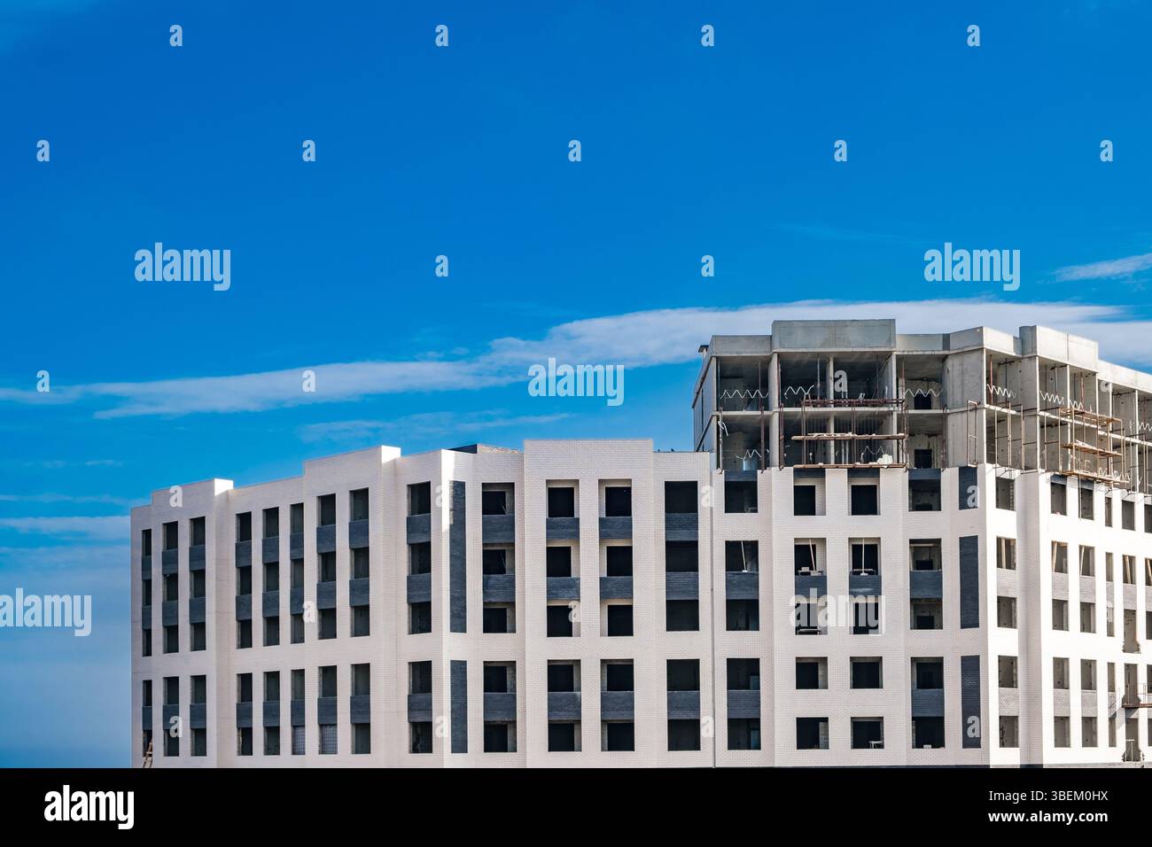 monolithic building under construction decorated with brickwork Stock ...