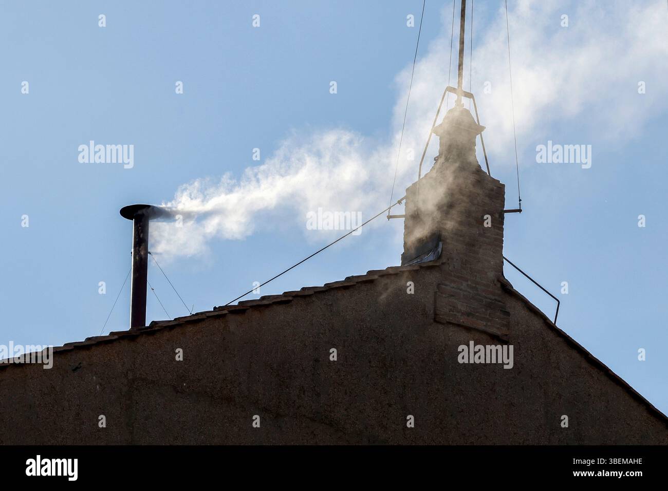 Vatican City, 8 May, 2025. White smoke emerges from the chimney atop ...