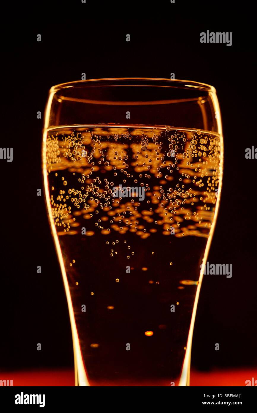 A close-up shot showcases the detailed bubbles in a sparkling water ...