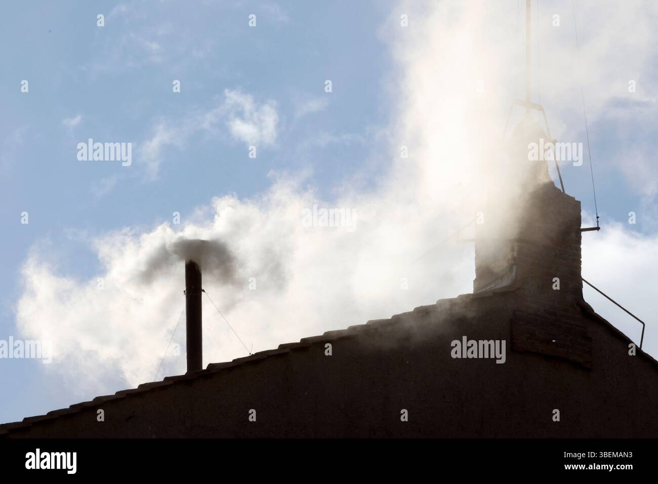 Vatican City, 8 May, 2025. White smoke emerges from the chimney atop ...